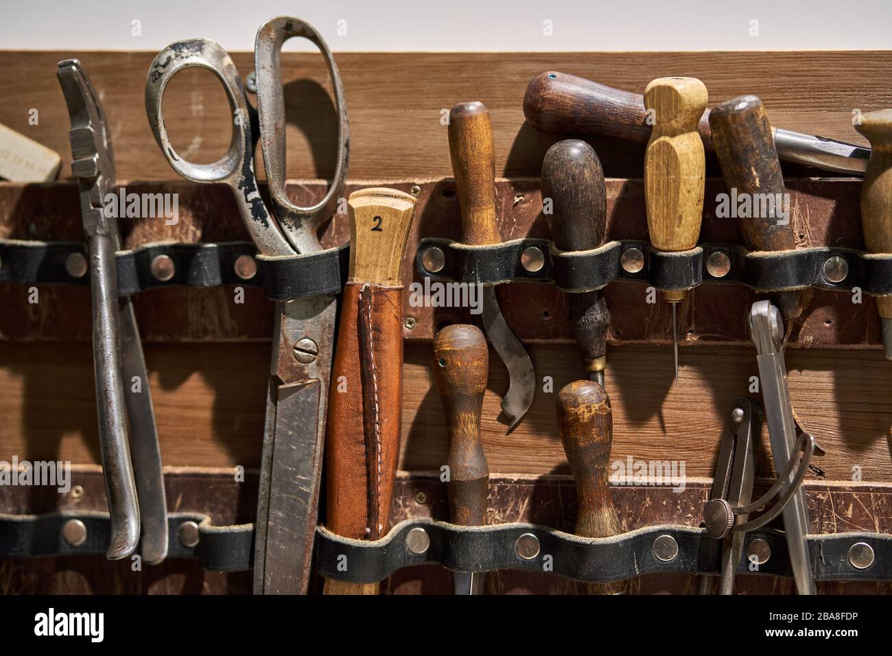 Closeup view at instruments for leather sewing Stock Photo - Alamy