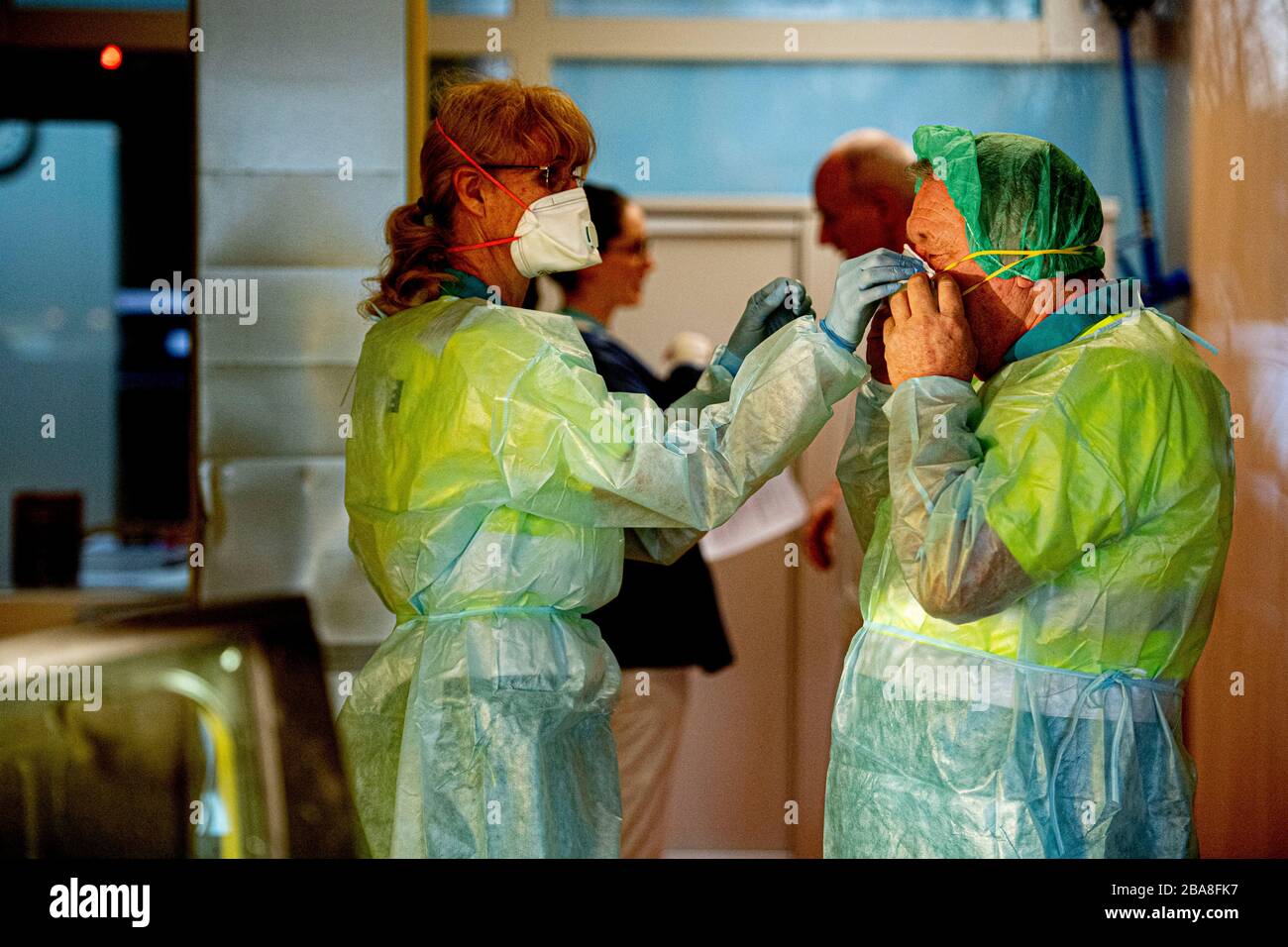Breda, Netherlands. 21st Mar, 2020. Paramedics wear masks as a ...