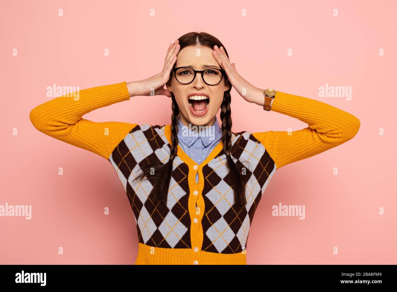 stressed yelling female nerd in glassess on pink Stock Photo - Alamy