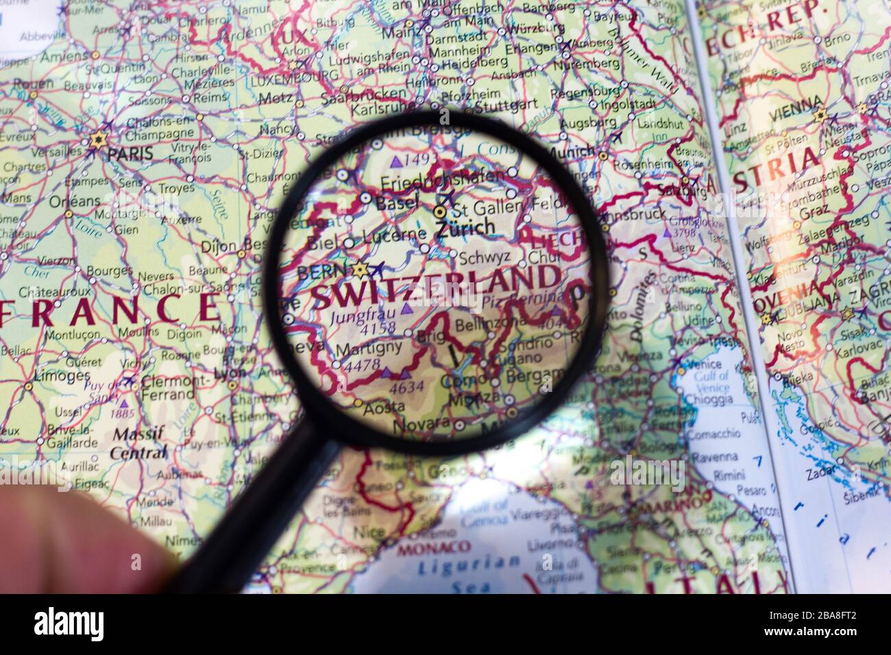 Switzerland on the map of the world or atlas Stock Photo - Alamy