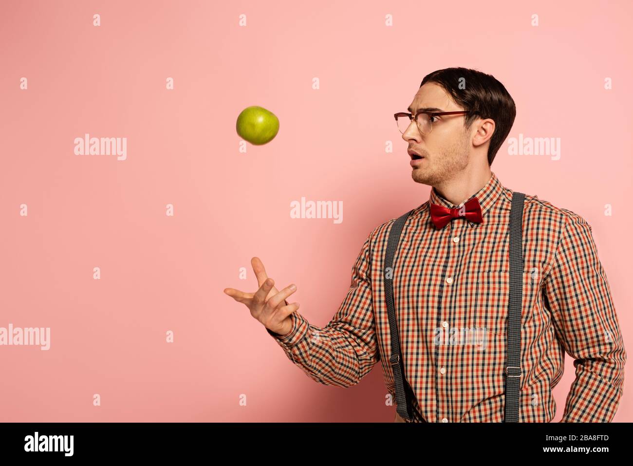Man throwing apple hi-res stock photography and images - Alamy