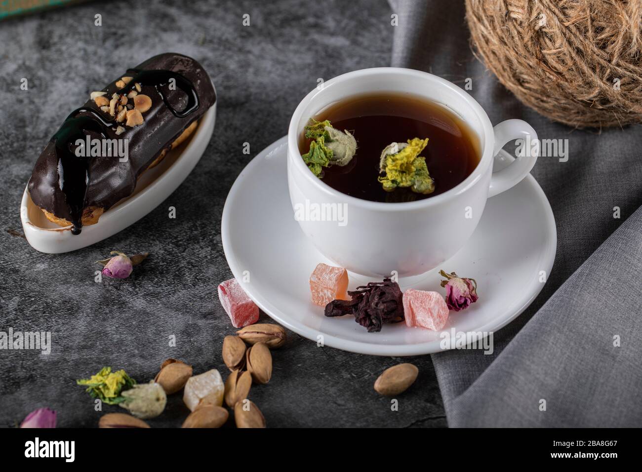 A cup of tea with chocolate eclair . top view Stock Photo - Alamy