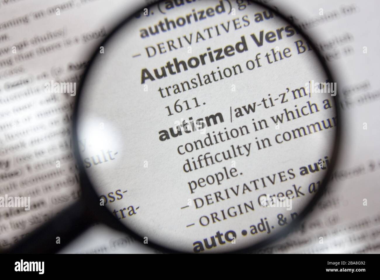 The word of phrase autism in a dictionary Stock Photo - Alamy