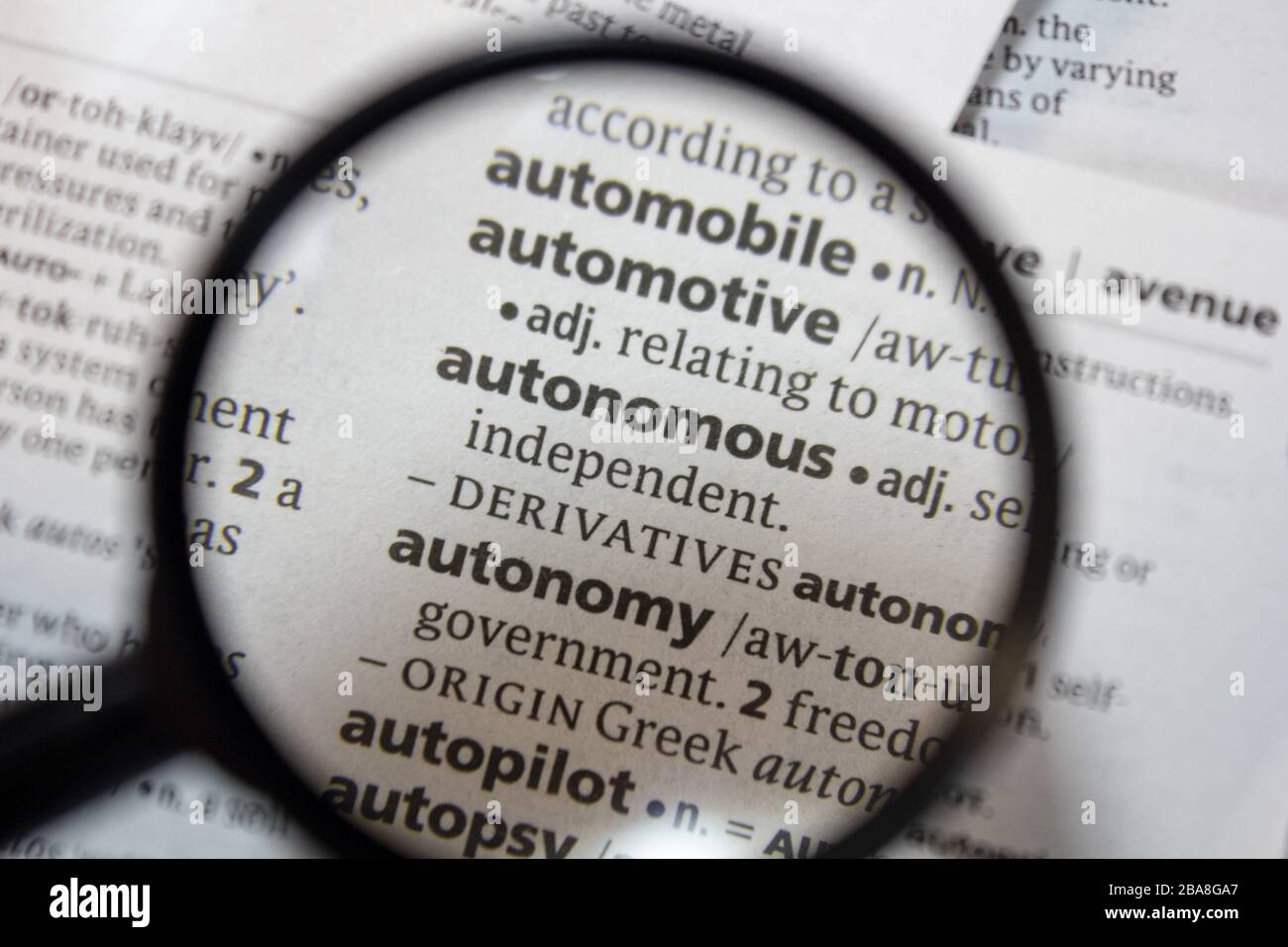 The word of phrase autonomous in a dictionary Stock Photo - Alamy