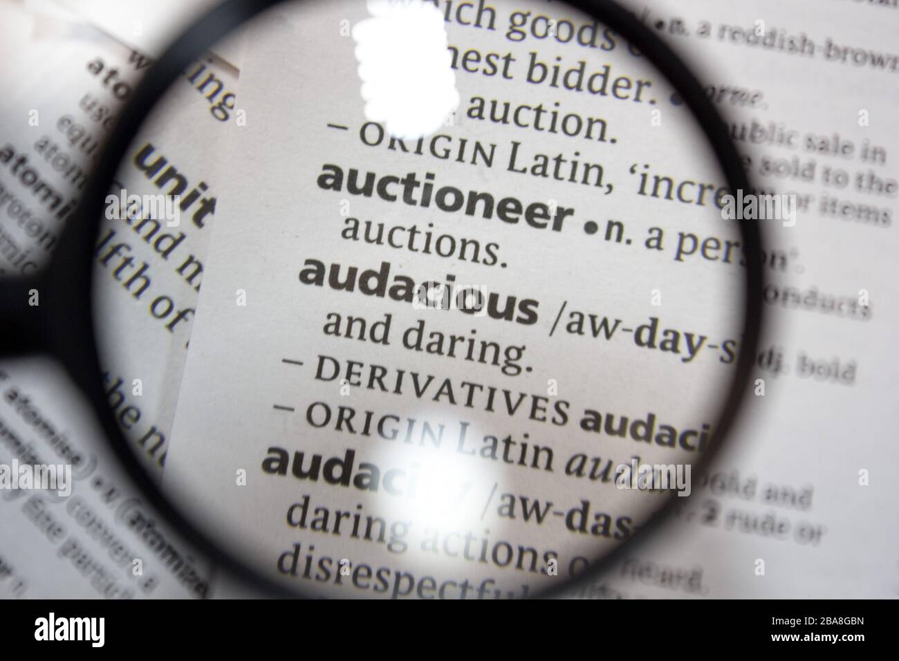 The word of phrase audacious in a dictionary Stock Photo - Alamy