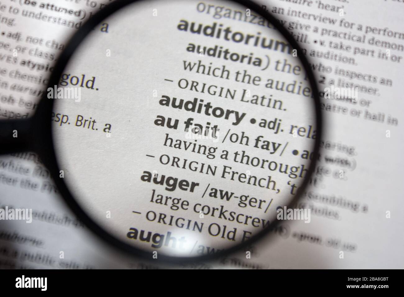 The word of phrase au fait in a dictionary Stock Photo - Alamy