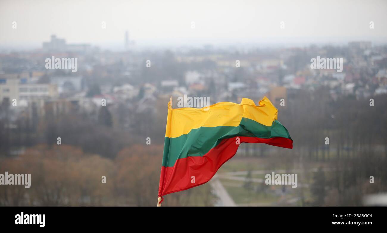 The Lithuanian flag is waving in tricolor over the city Stock Photo - Alamy