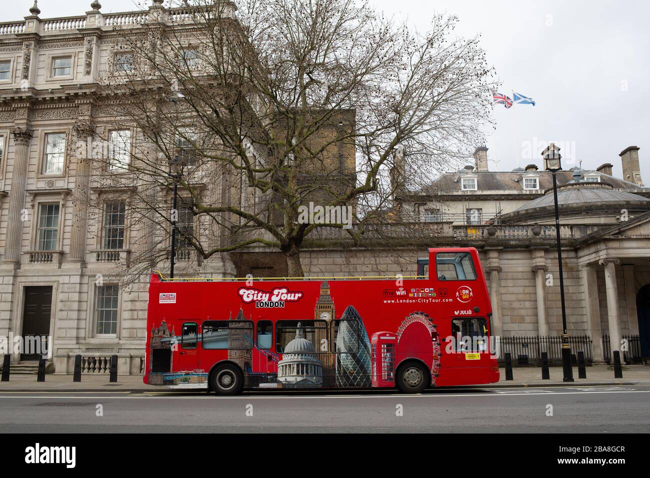 An empty tour bus on Whitehall in London. Some parts of central London ...