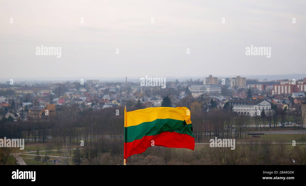 The Lithuanian flag is waving in tricolor over the city Stock Photo - Alamy