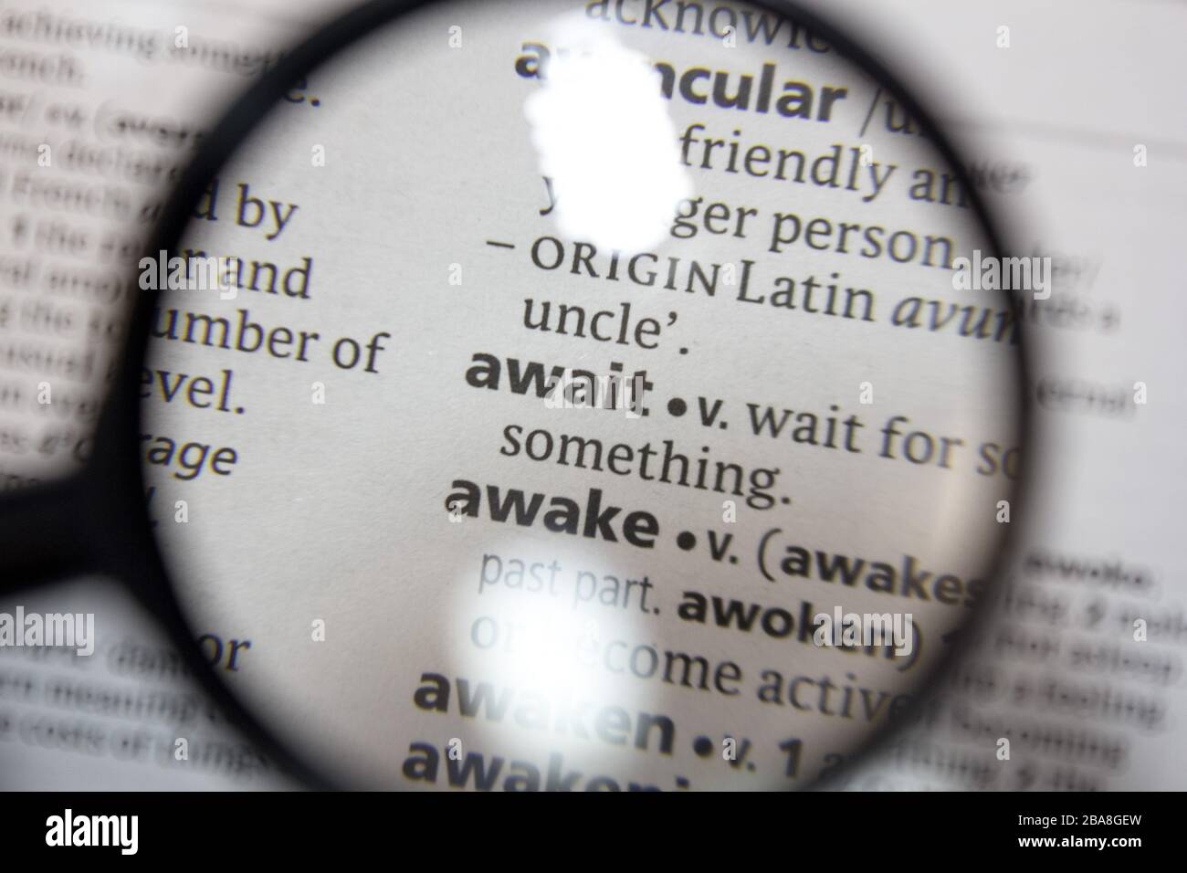 The word of phrase await in a dictionary Stock Photo - Alamy
