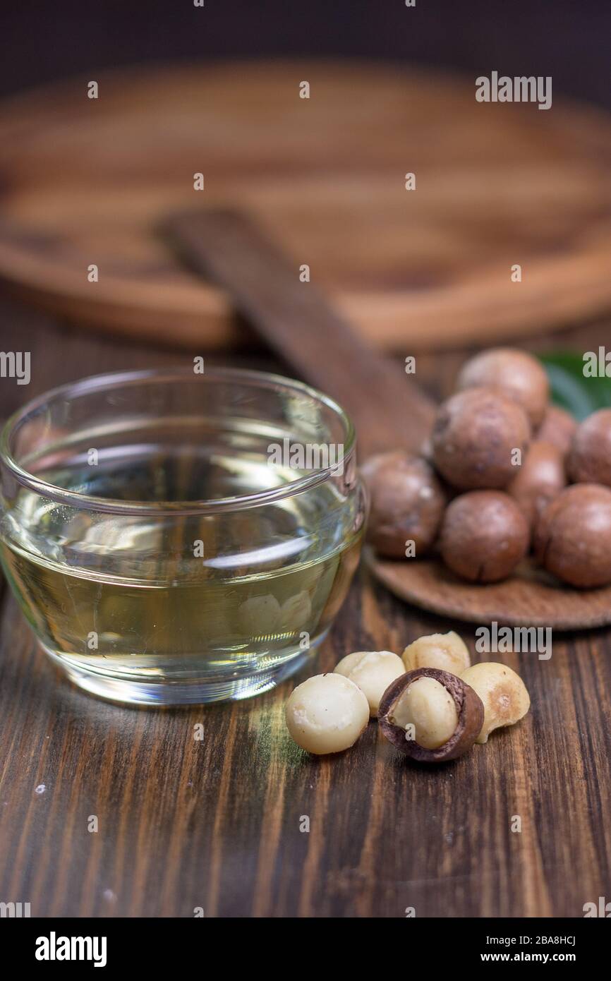 Macadamia nuts without shell over the wooden background. Great photo ...