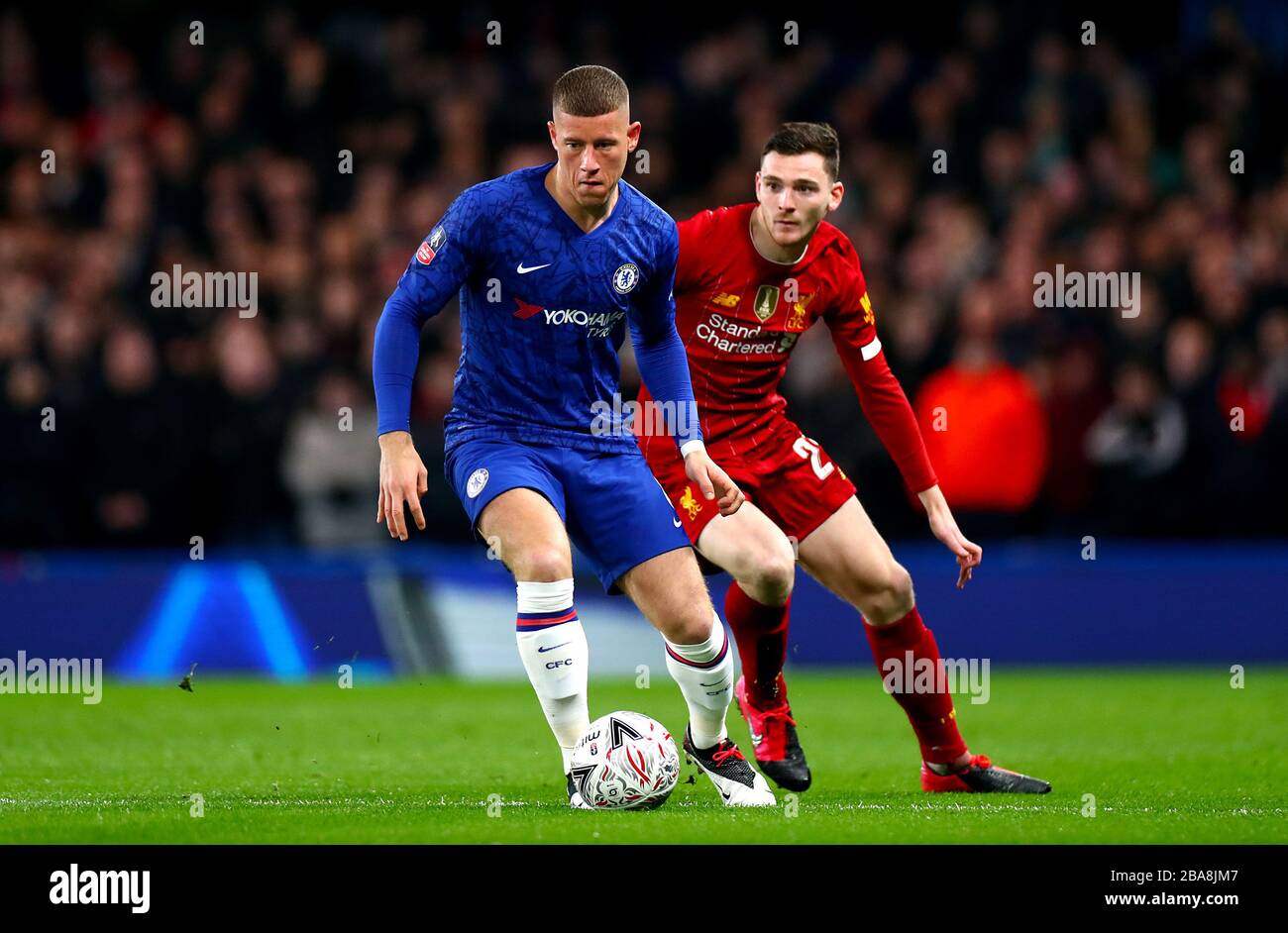 Chelsea's Ross Barkley (left) and Liverpool's Andrew Robertson battle ...