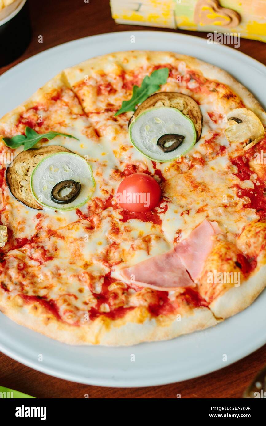 Funny face pizza for kids in a restaurant, great image for your needs ...