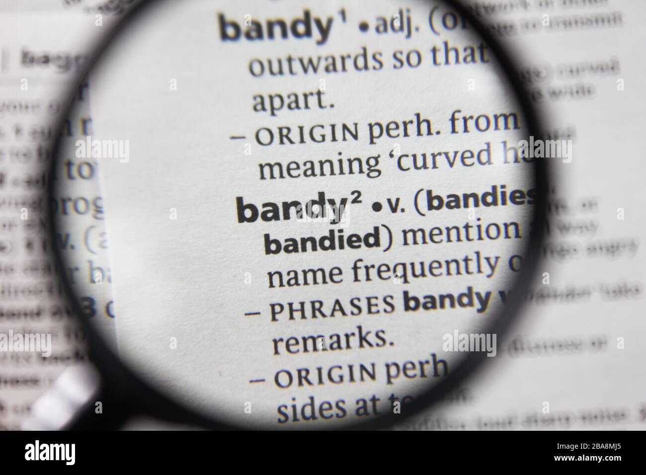 The word or phrase bandy in a dictionary Stock Photo - Alamy