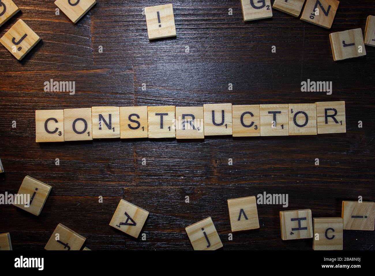 Word or phrase Constructor made with scrabble letters on black table ...