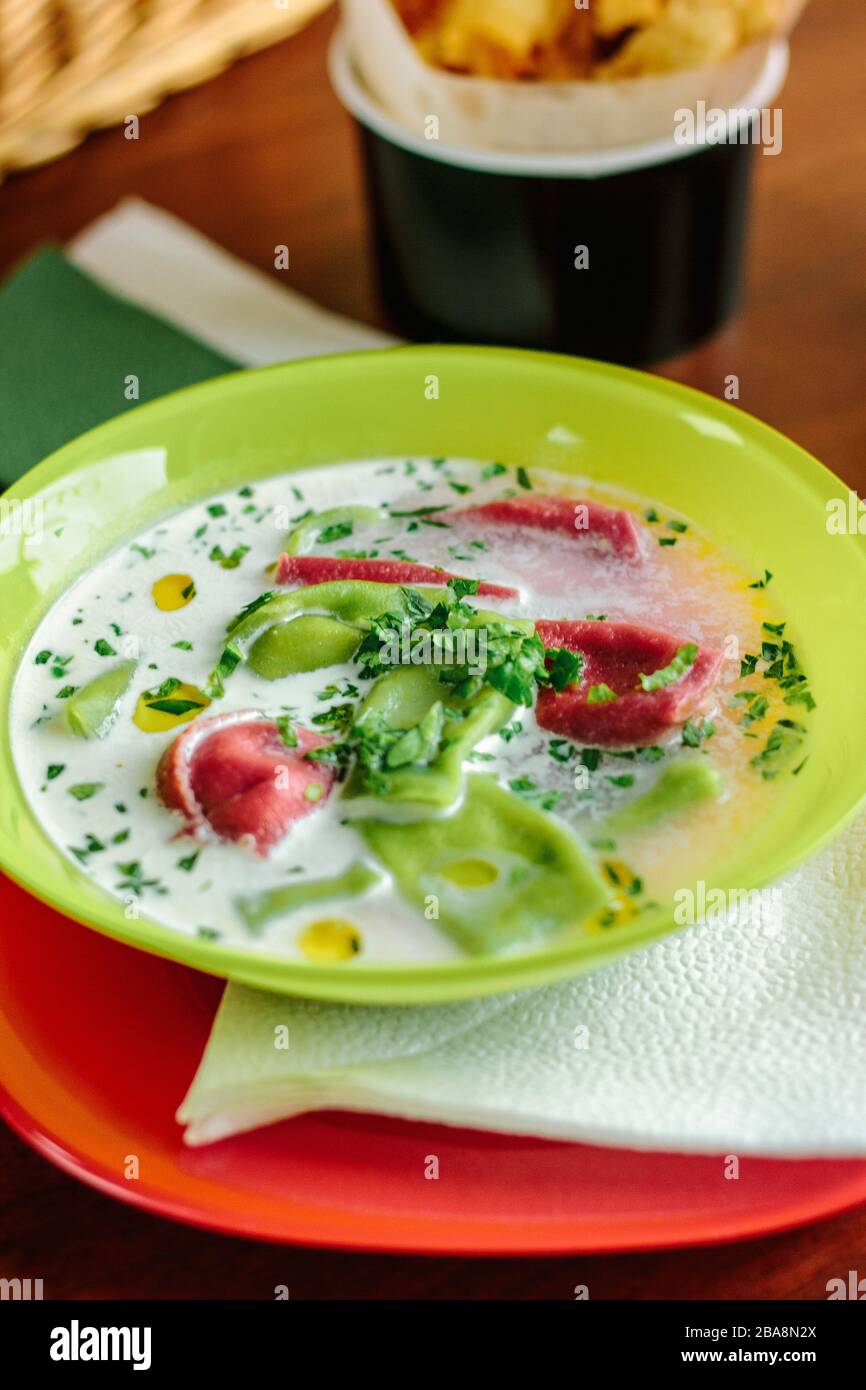 Green and red ravioli in soup for kids, great image for your needs ...