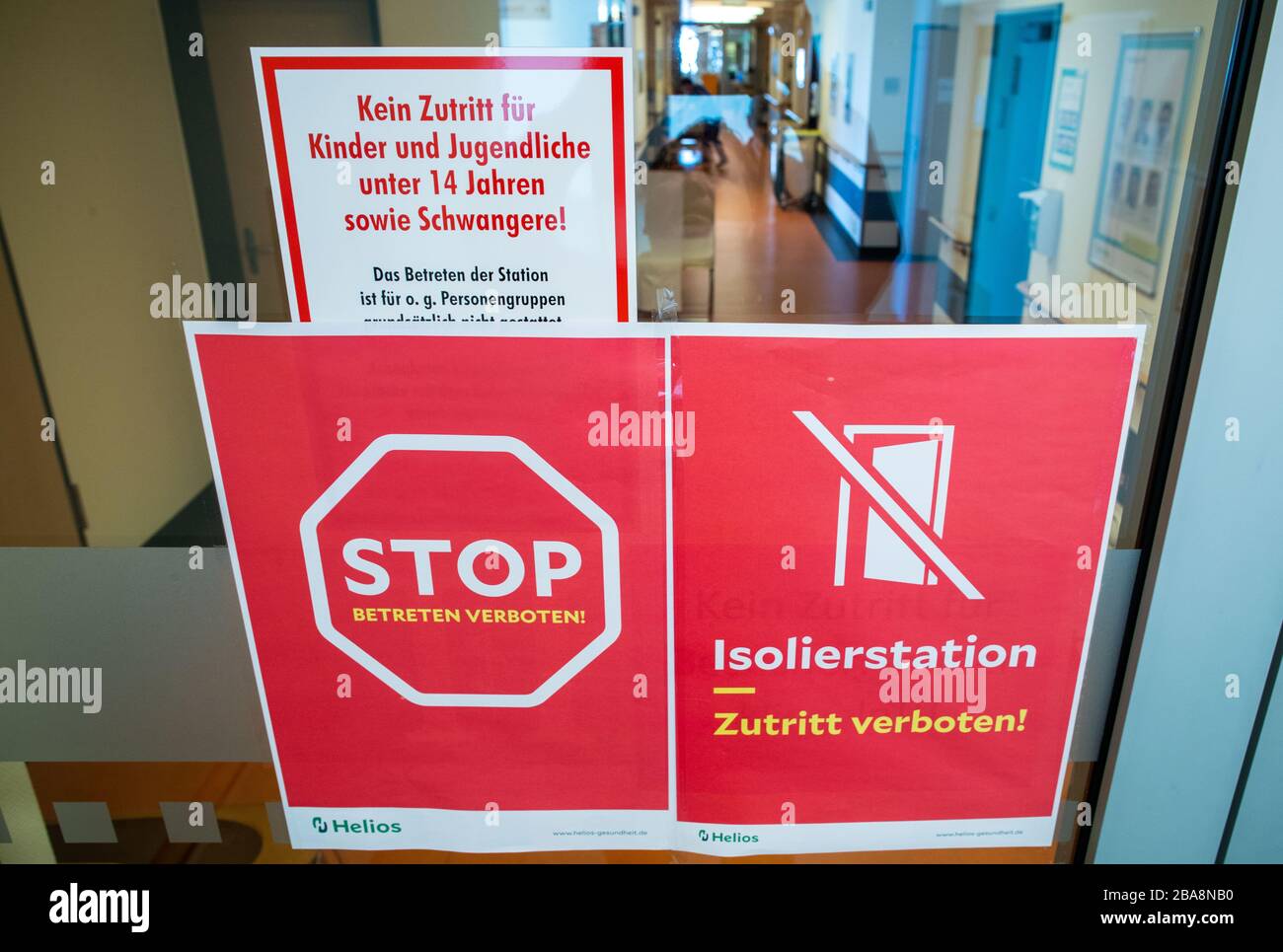 Schwerin, Germany. 26th Mar, 2020. A stop sign hangs on the access door ...