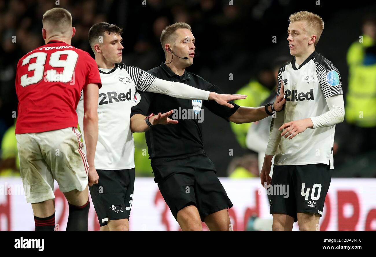 Derby County's Louie Sibley (right) reacts after a challenge by ...