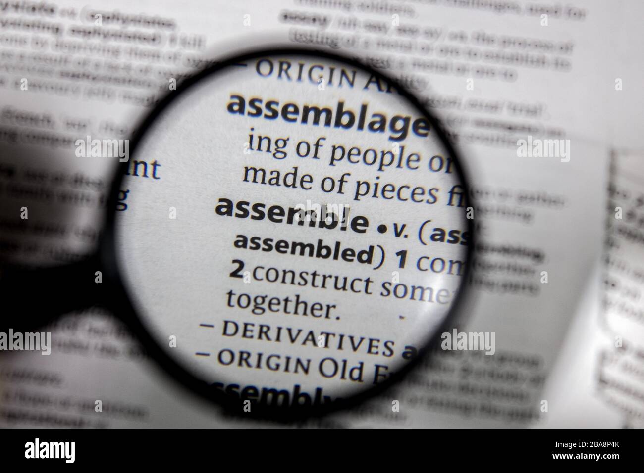 The word or phrase assemble in a dictionary book Stock Photo - Alamy