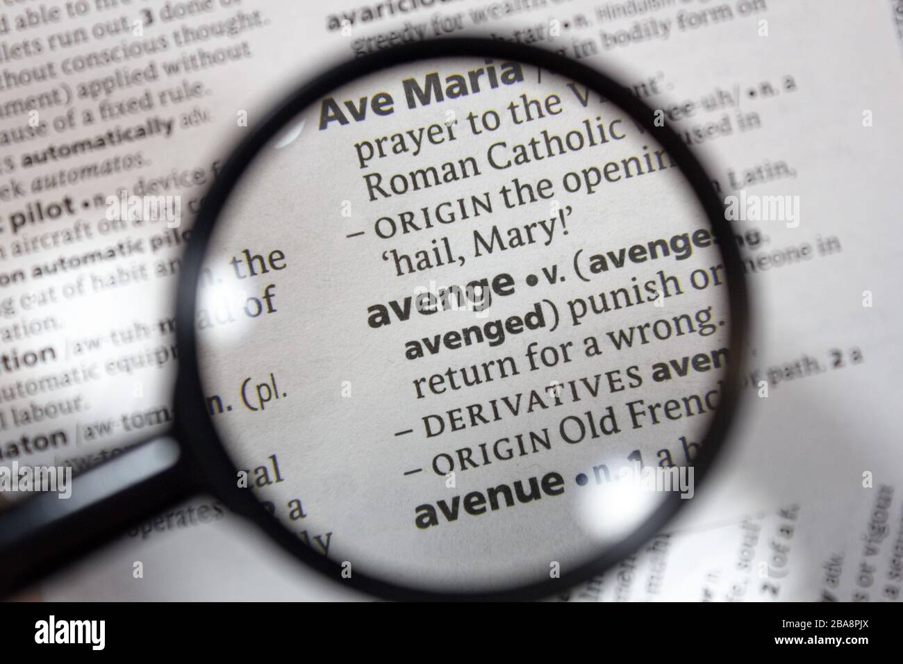 The word of phrase avenge in a dictionary Stock Photo - Alamy