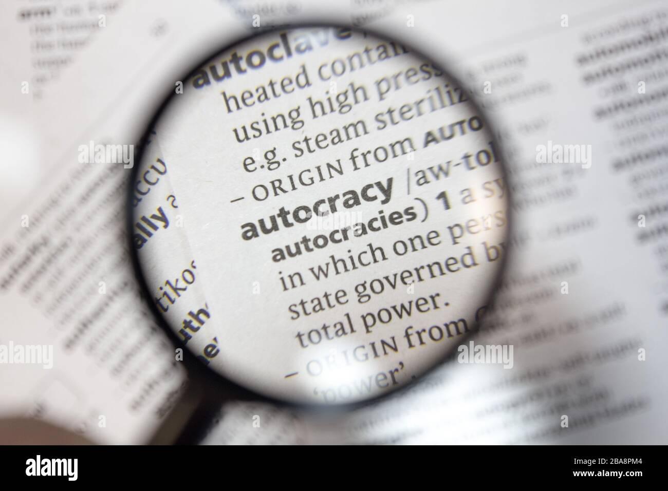 The word of phrase autocracy in a dictionary Stock Photo - Alamy