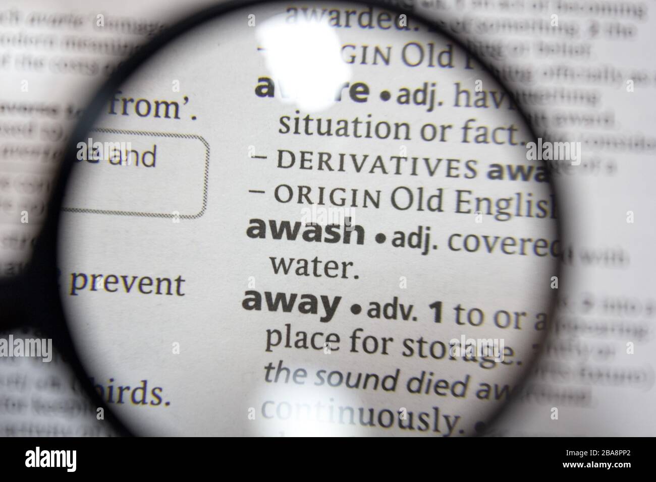 The word of phrase awash in a dictionary Stock Photo - Alamy