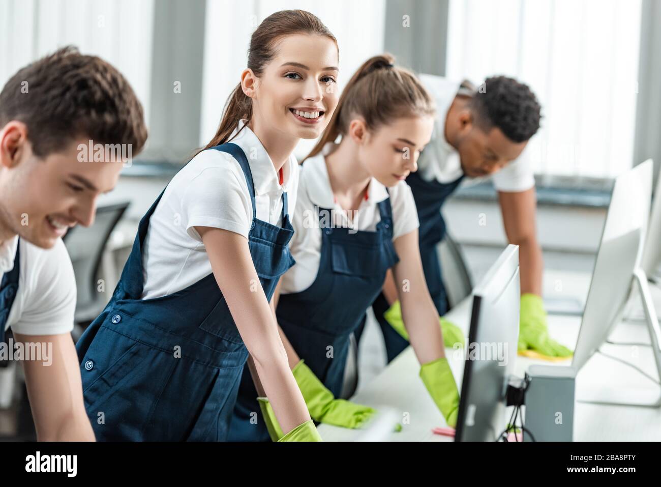 Smiling multicultural team cleaners hi-res stock photography and images ...