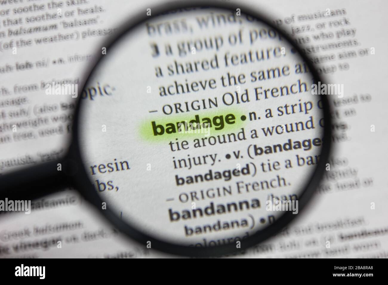 The word or phrase bandage in a dictionary Stock Photo - Alamy