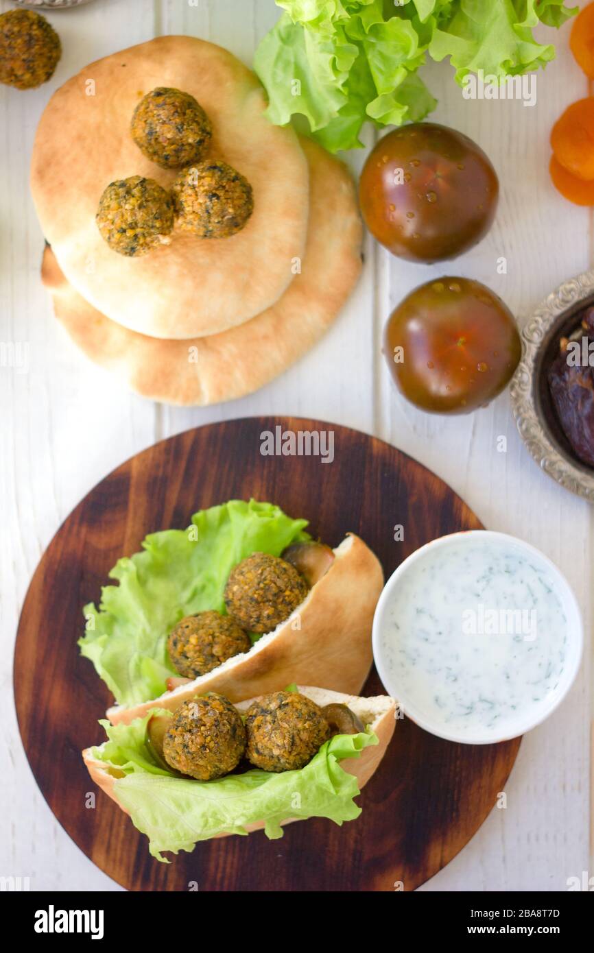 Top view of falafel with vegetables and pita bread Stock Photo - Alamy