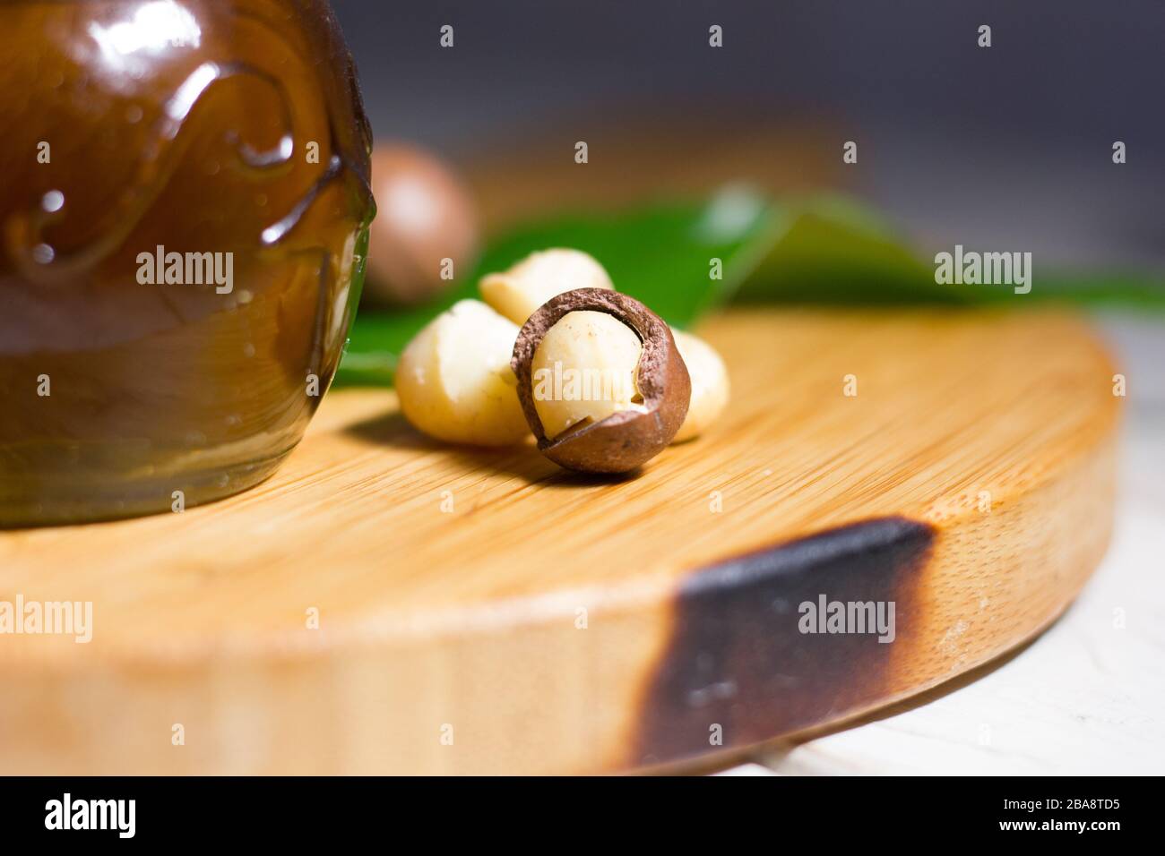 Macadamia nuts without shell over the wooden background. Great photo ...