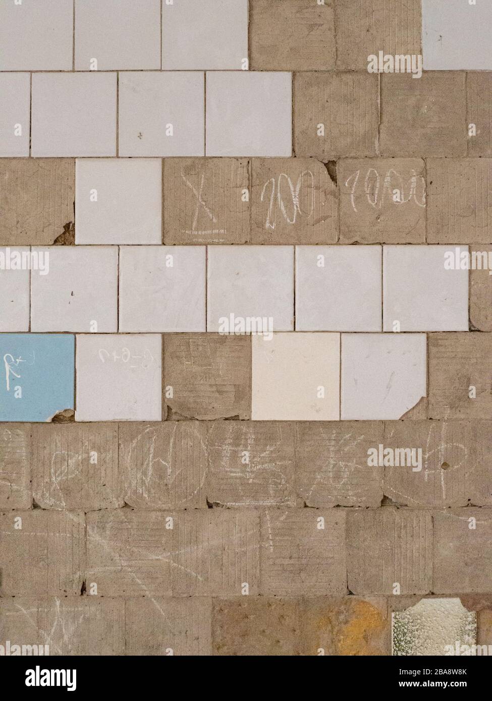 Old tiles and textures on decaying house wall Stock Photo - Alamy