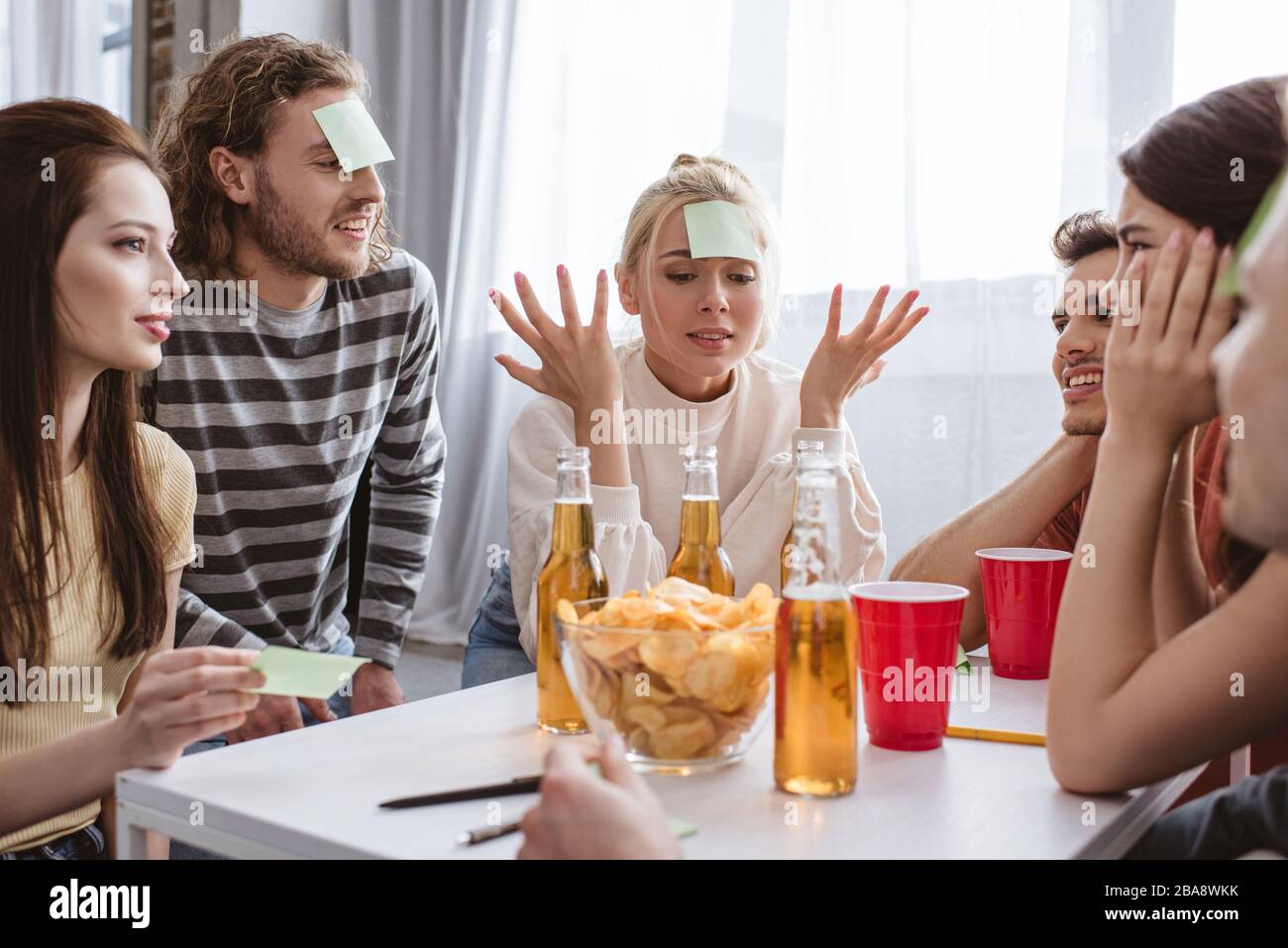 confused girl showing shrug gesture while playing name game with ...