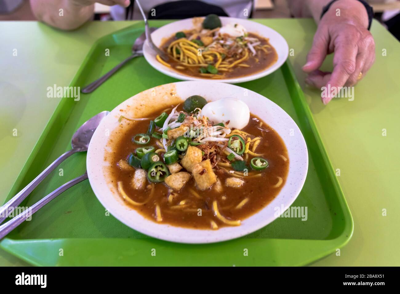 Dish of Mie rebus noodles at a hawker stall in Singapore Stock Photo ...