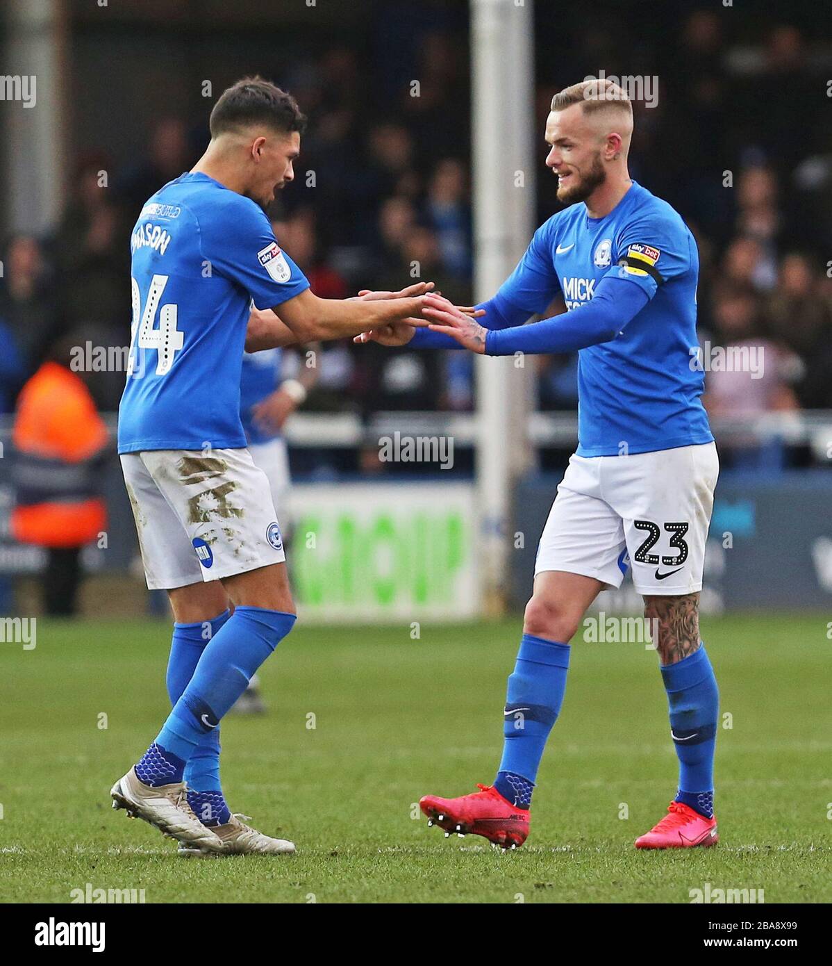 Peterborough United's Niall Mason (left) and Peterborough United's Joe ...