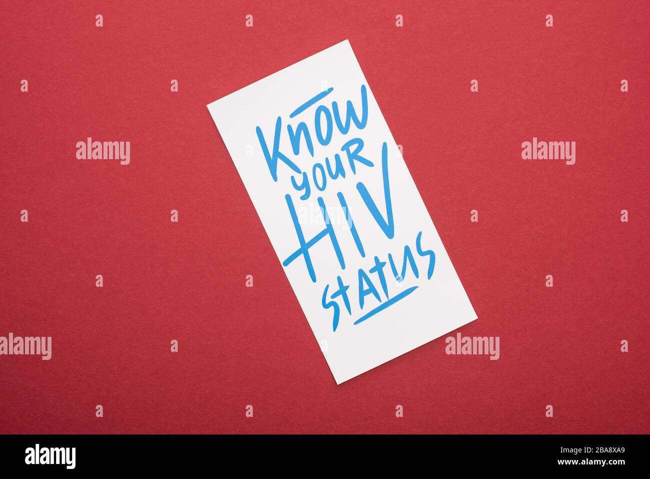 top view of card with know your HIV status lettering on red background ...