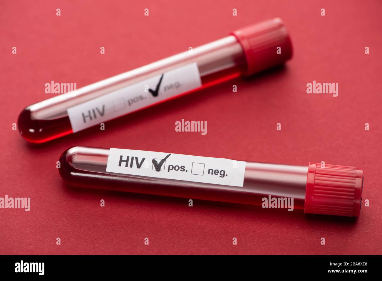 selective focus of negative and positive hiv blood sample test on red ...
