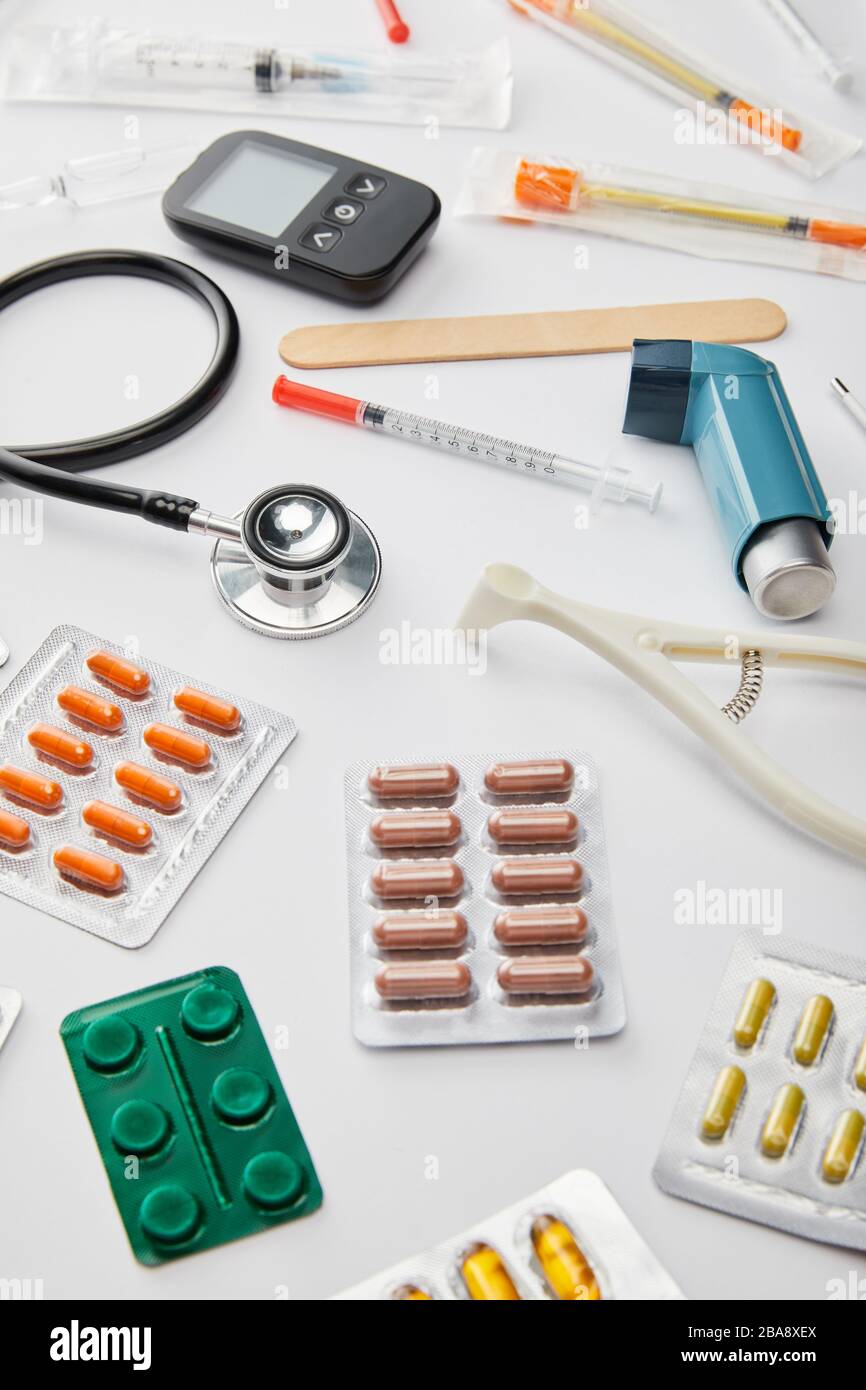 Selective focus of stethoscope, asthma inhaler and medical objects on ...