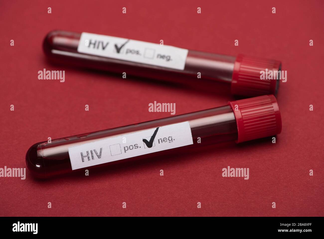 selective focus of negative and positive hiv blood sample test on red ...