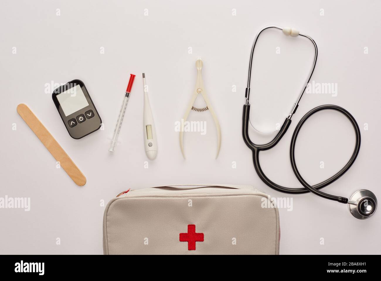 Top view of first aid kit with medical objects on white Stock Photo - Alamy