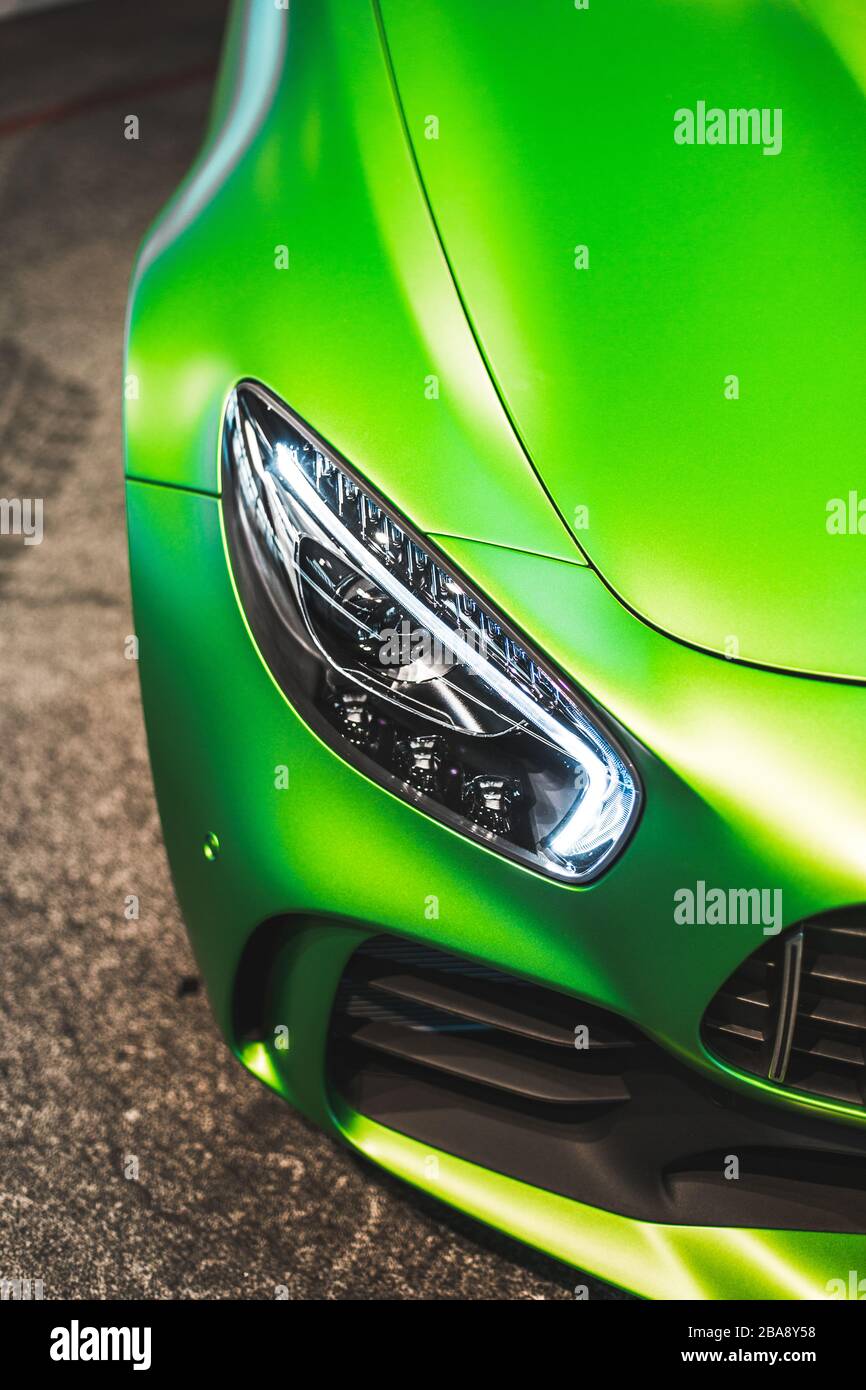 Front bumper and light of a green car Stock Photo - Alamy