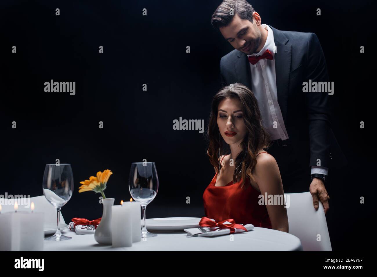 Girl standing behind table hi-res stock photography and images - Alamy