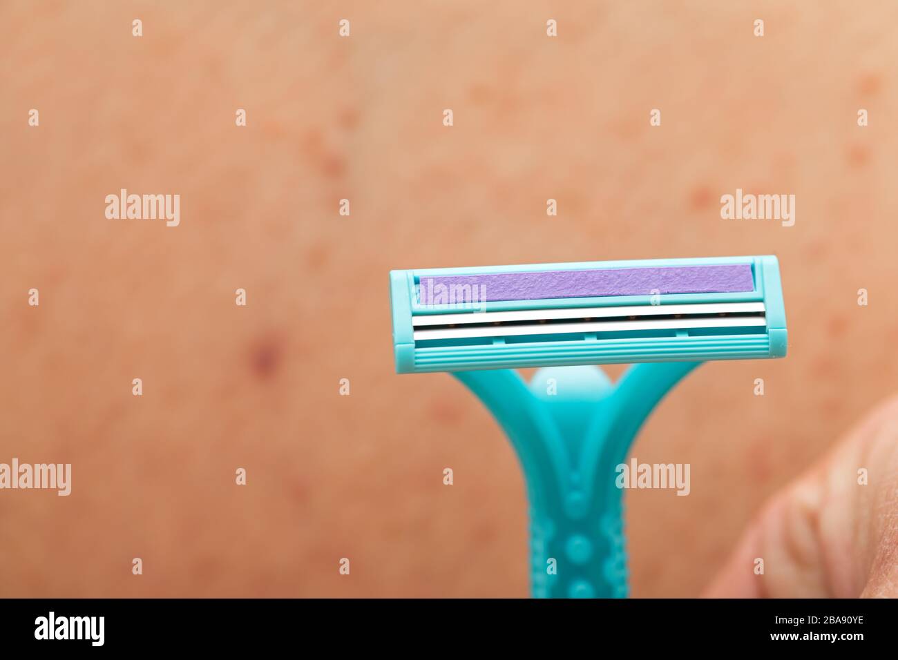 Woman holding razor hi-res stock photography and images - Alamy