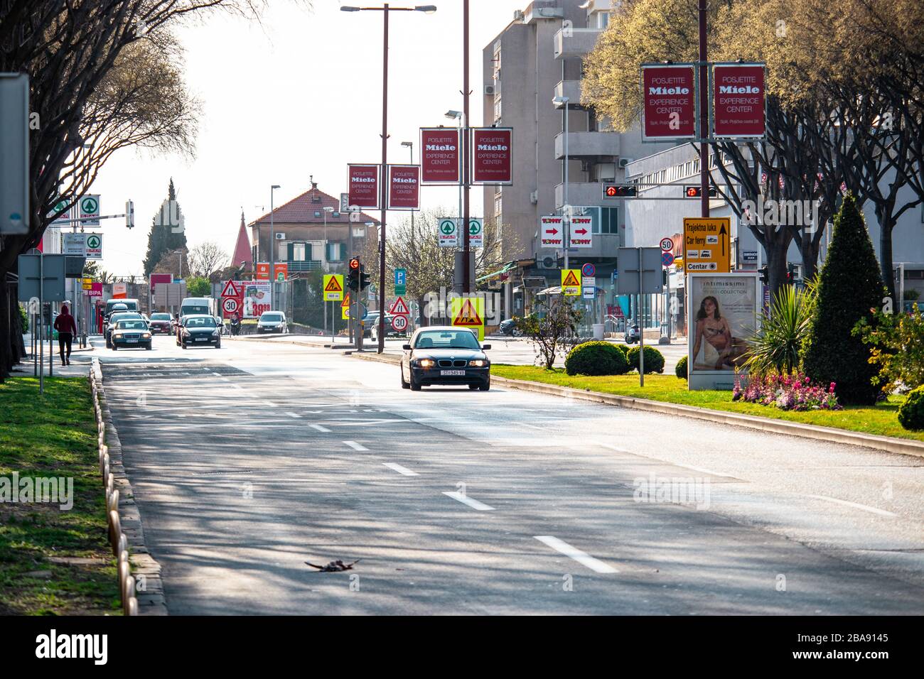 Three lane street in the center of town of Split, Croatia. Cars driving ...