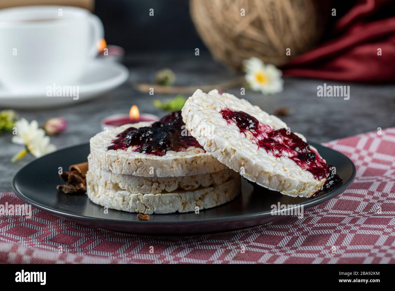 Rice cracker with red berry jam Stock Photo - Alamy