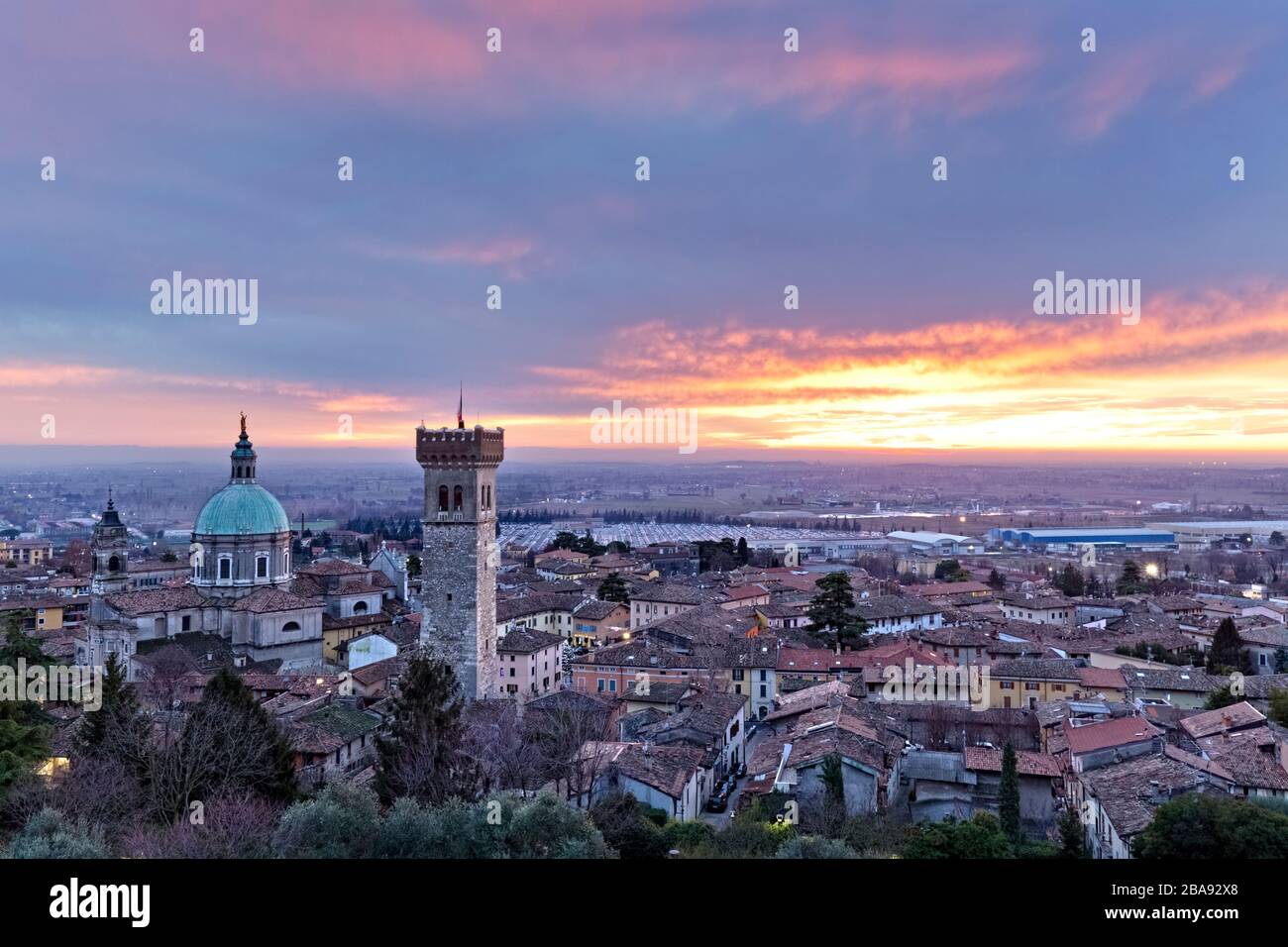 The medieval tower and the San Giovanni Battista Basilica of Lonato del ...