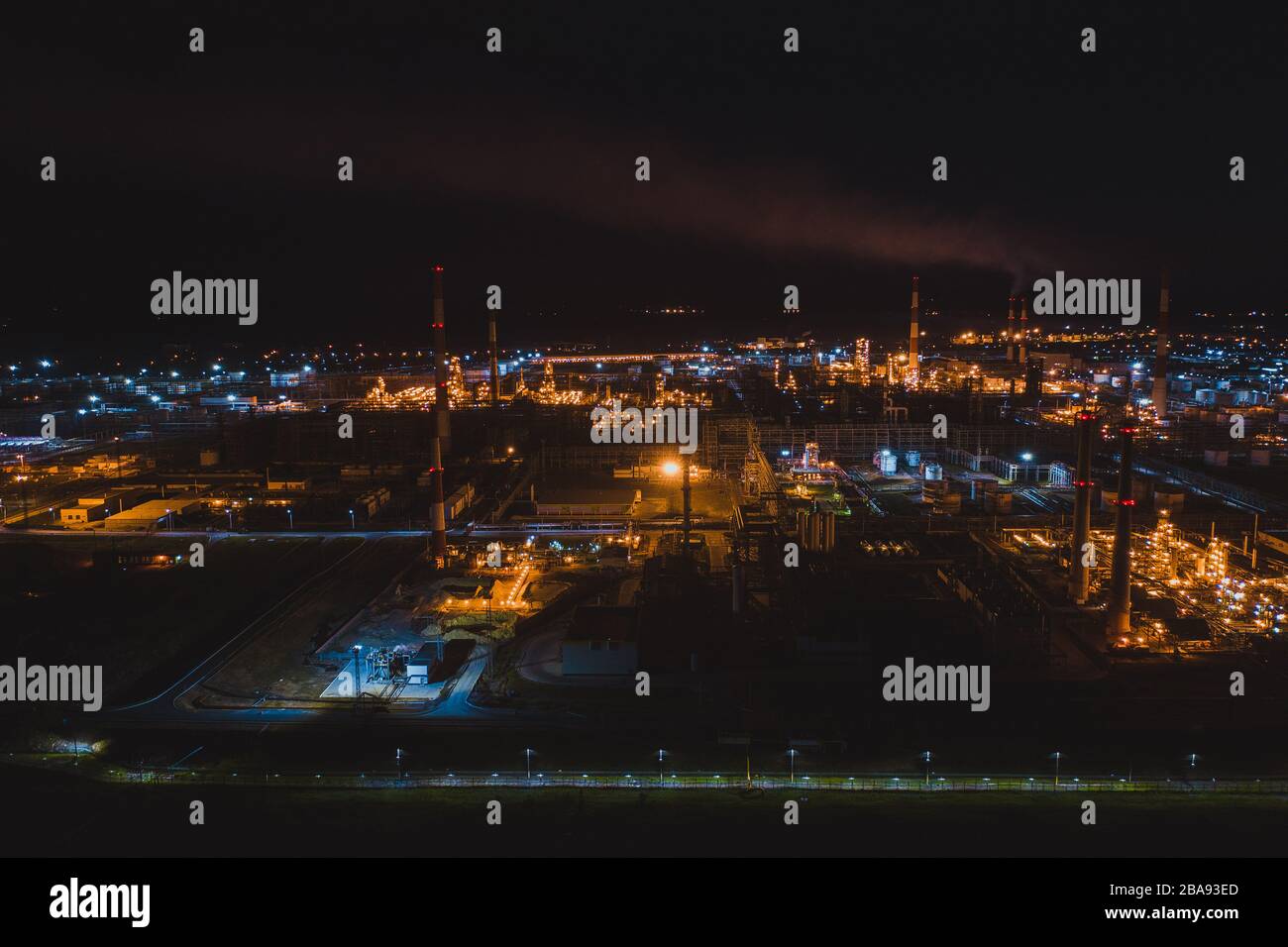 Oil refinery night Stock Photo - Alamy