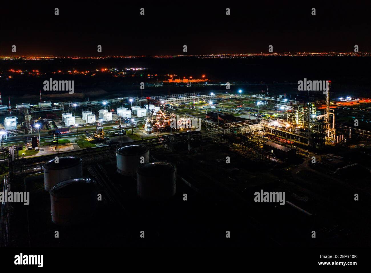 Oil refinery night Stock Photo - Alamy