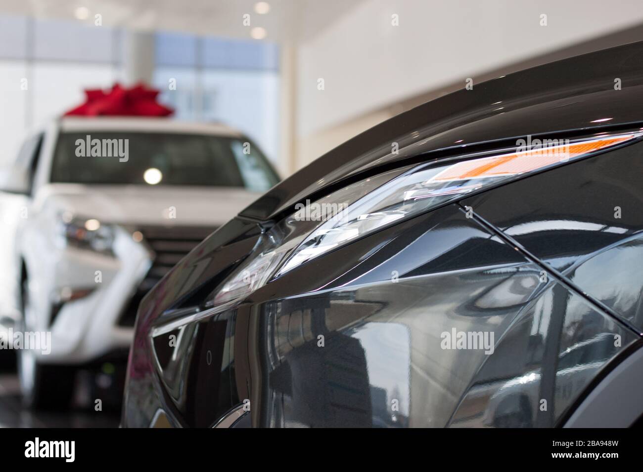 Car dealership. Themed blur background with bokeh effect. New cars at ...