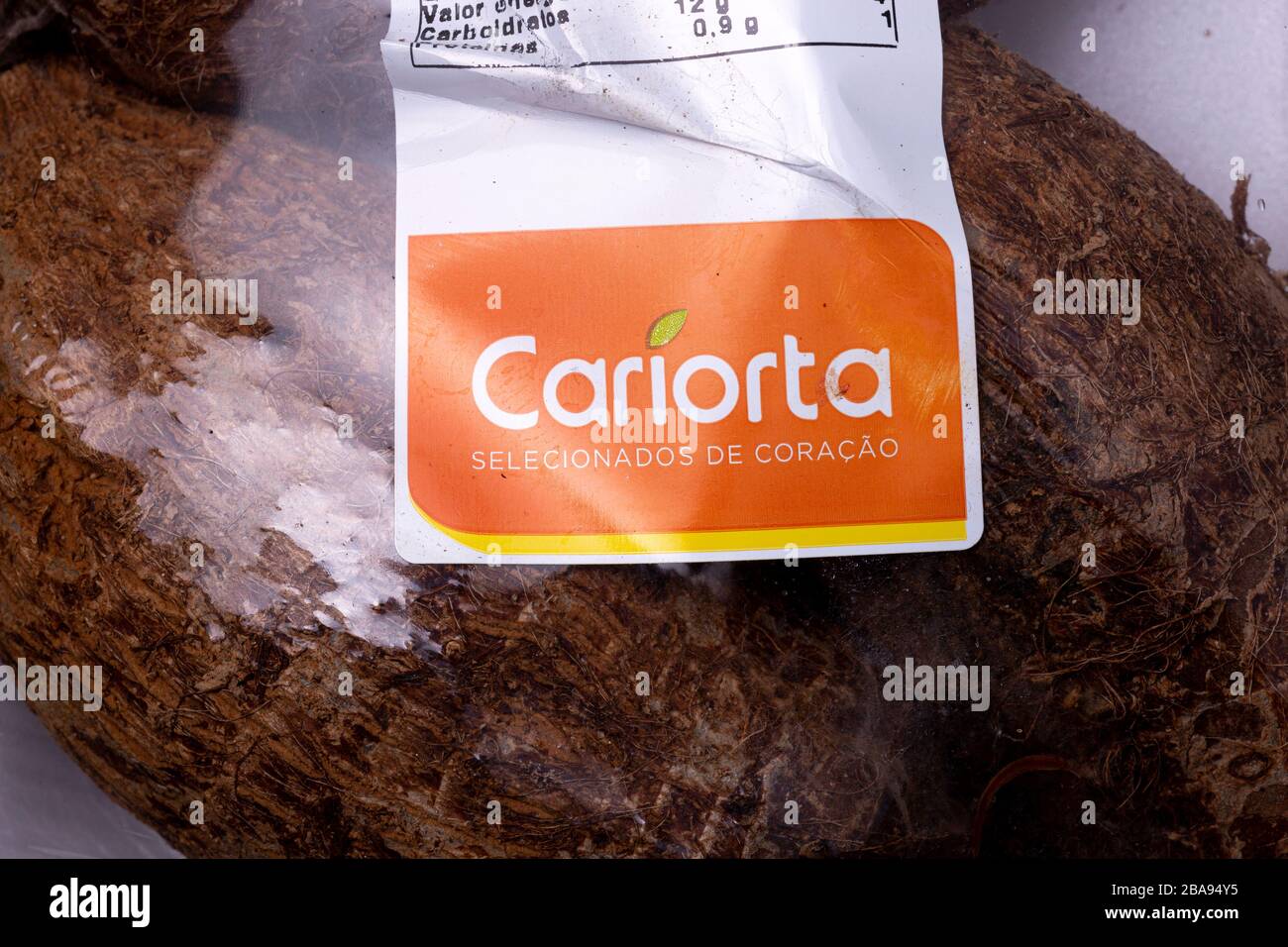 Close up of fresh plastic wrapped Brazilian Inhame or Yam in packing ...