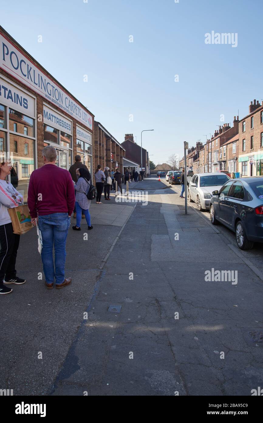 People queuing outside Tesco’s to get necessary shopping during the ...